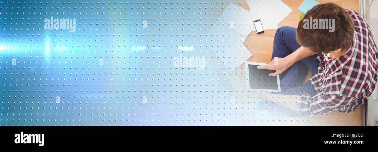 Overhead of man with tablet and blue smart tech transition Stock Photo ...