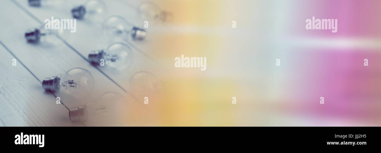 Lightbulbs on wood floor with blurry rainbow transition Stock Photo - Alamy