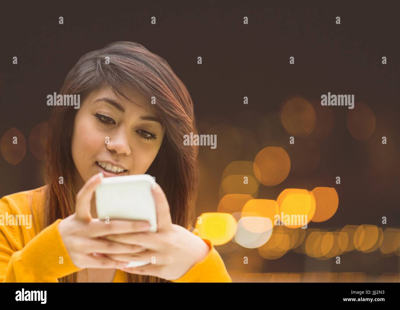 Woman Texting in night city lights bokeh Stock Photo - Alamy