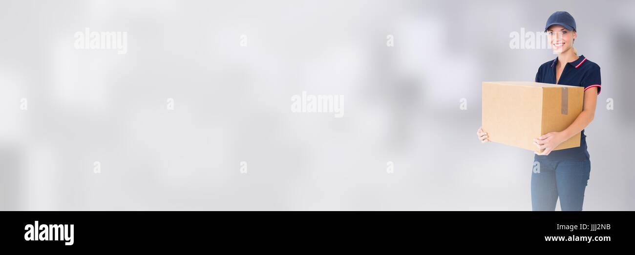 Delivery Courier with box in front of blurred and copy space background ...