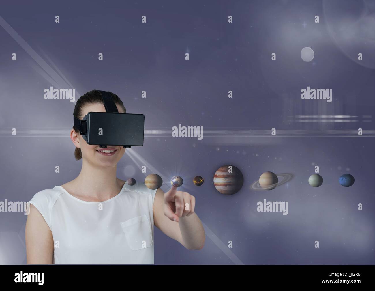 Woman in VR headset touching 3D planets with flares against purple ...