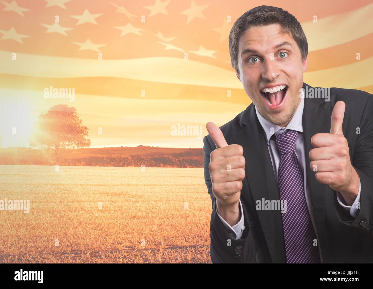 Happy business man with thumbs up against sunset landscape Stock Photo ...