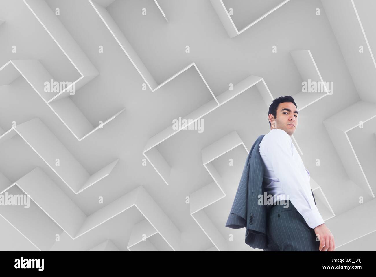 Man looking down against a background with a 3d maze Stock Photo - Alamy