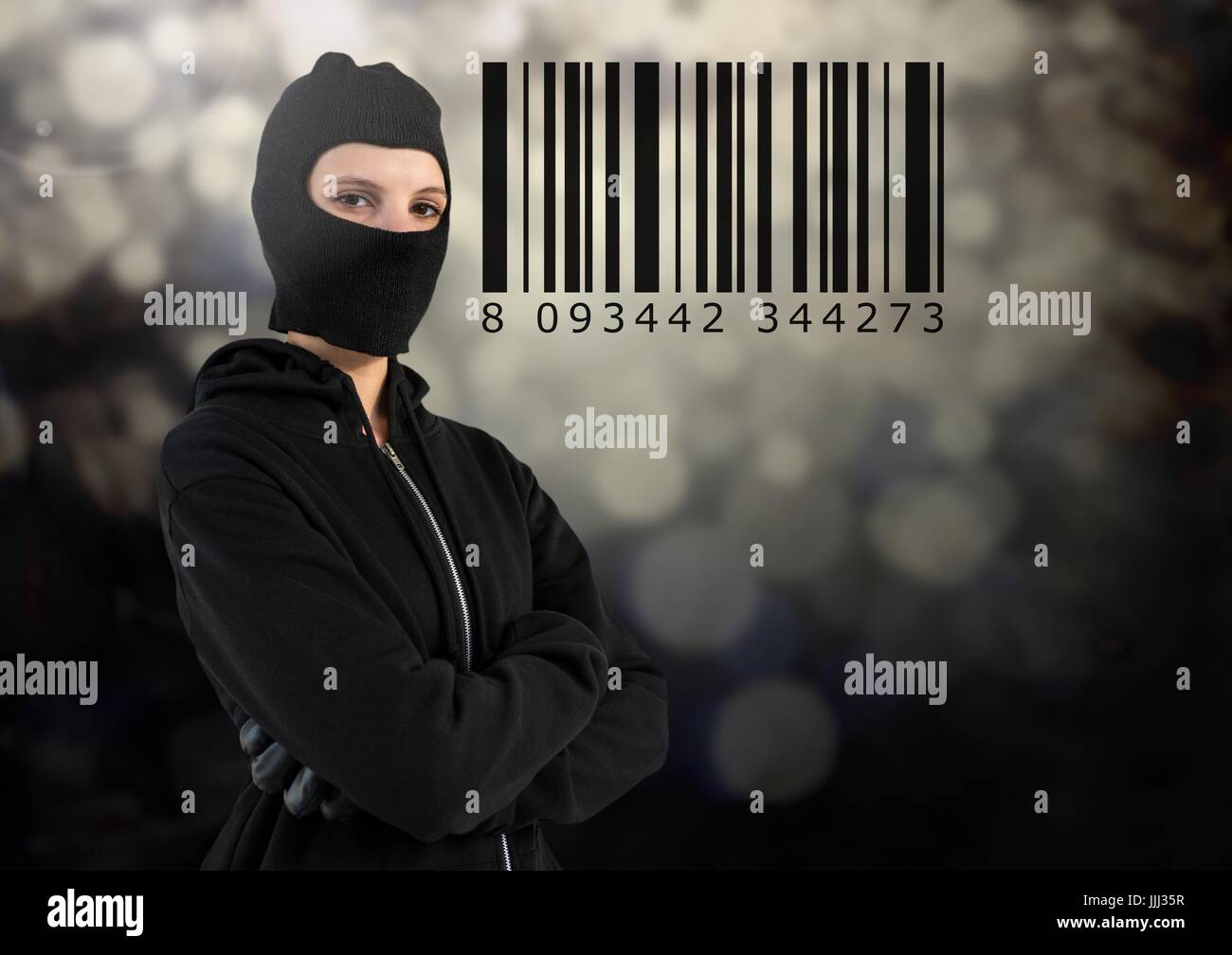 Woman hacker with hood in front of grey background with a bar code ...