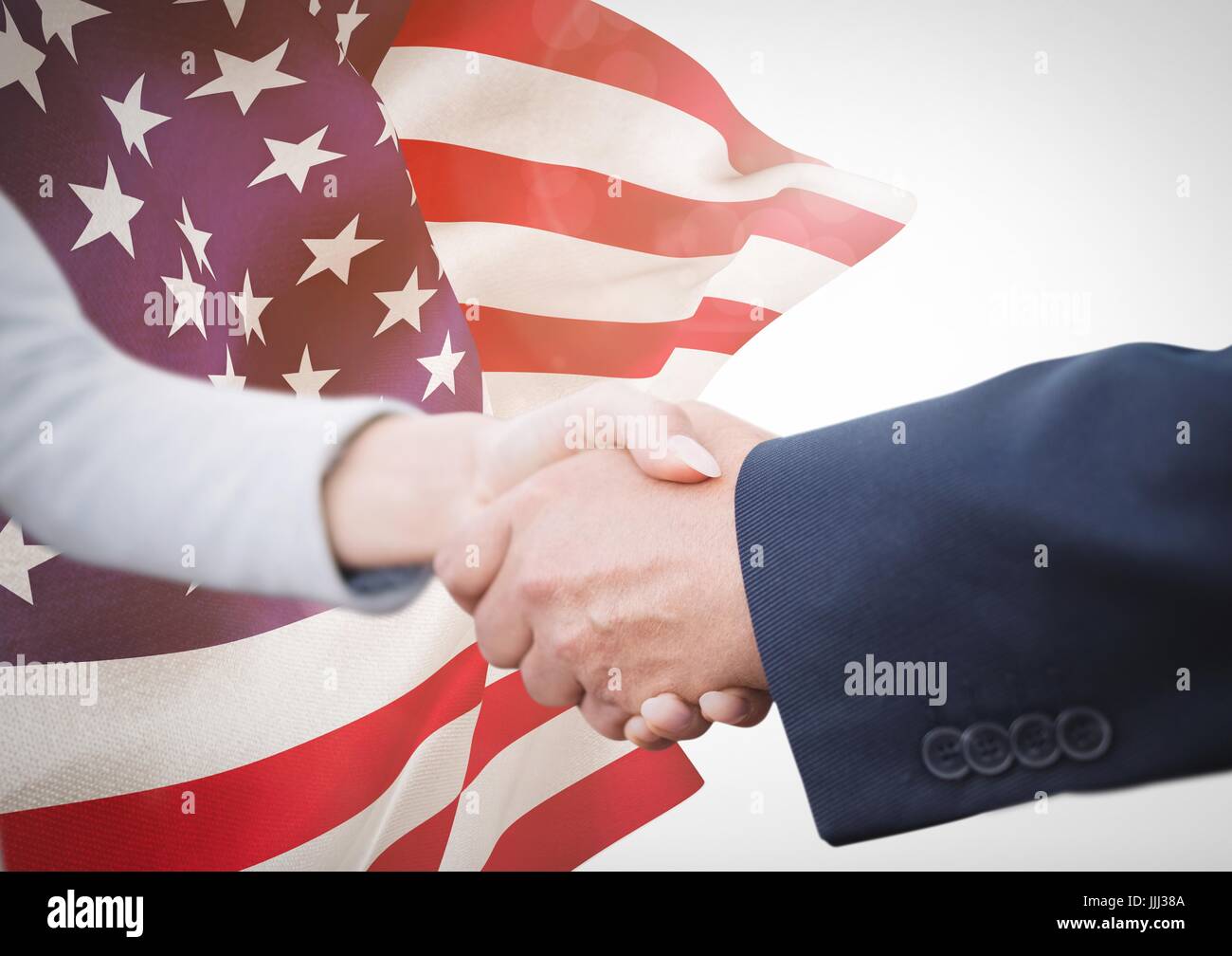Business people shaking their hands against american flag Stock Photo ...