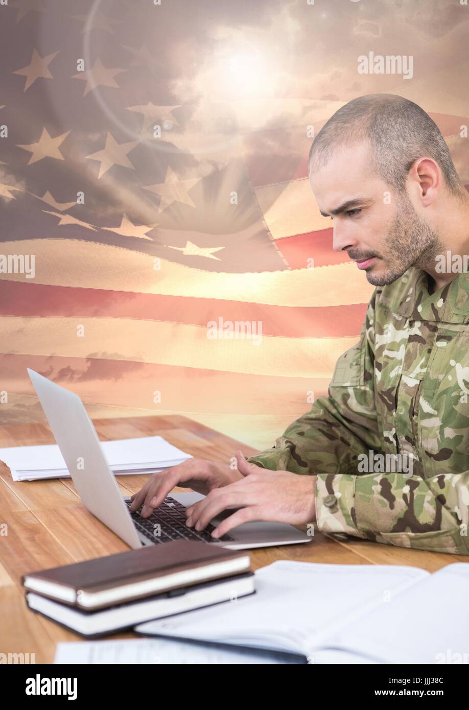 Military working on his laptop against american flag Stock Photo - Alamy