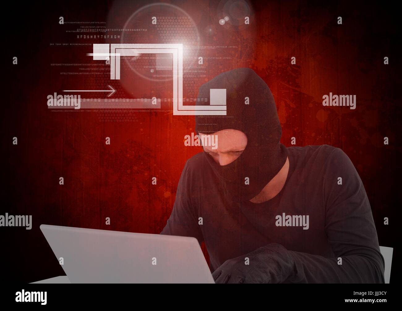 Hacker working on laptop in front of digital red background Stock Photo ...