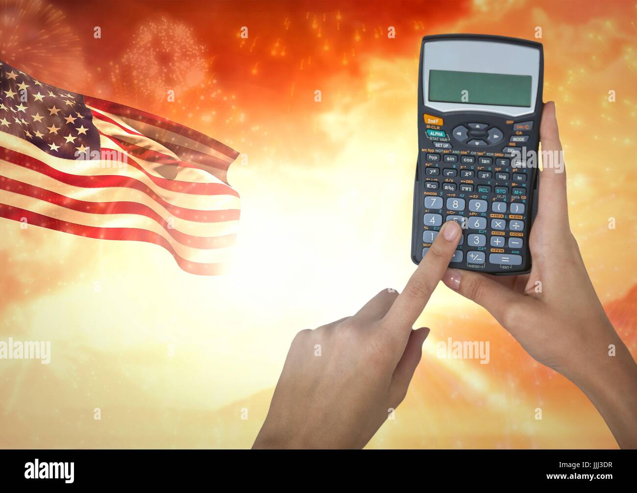 Hand holding a calculator against american flag Stock Photo - Alamy