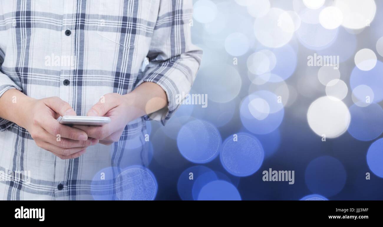 Part of a man texting in colored lights background Stock Photo - Alamy