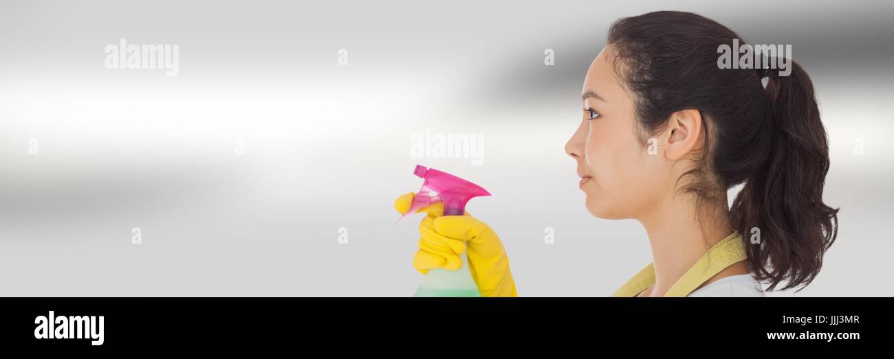 Cleaner with spray with bright background Stock Photo - Alamy