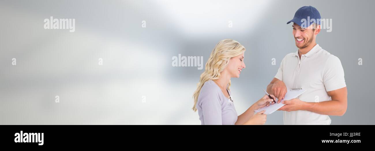 Delivery Courier with client signing forms in front of blurred copy ...