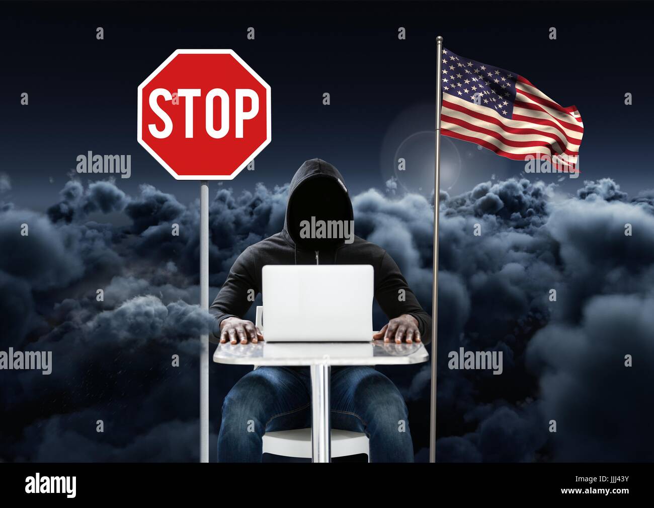 Hacker working on laptop near to 3D american flag and stop board with ...