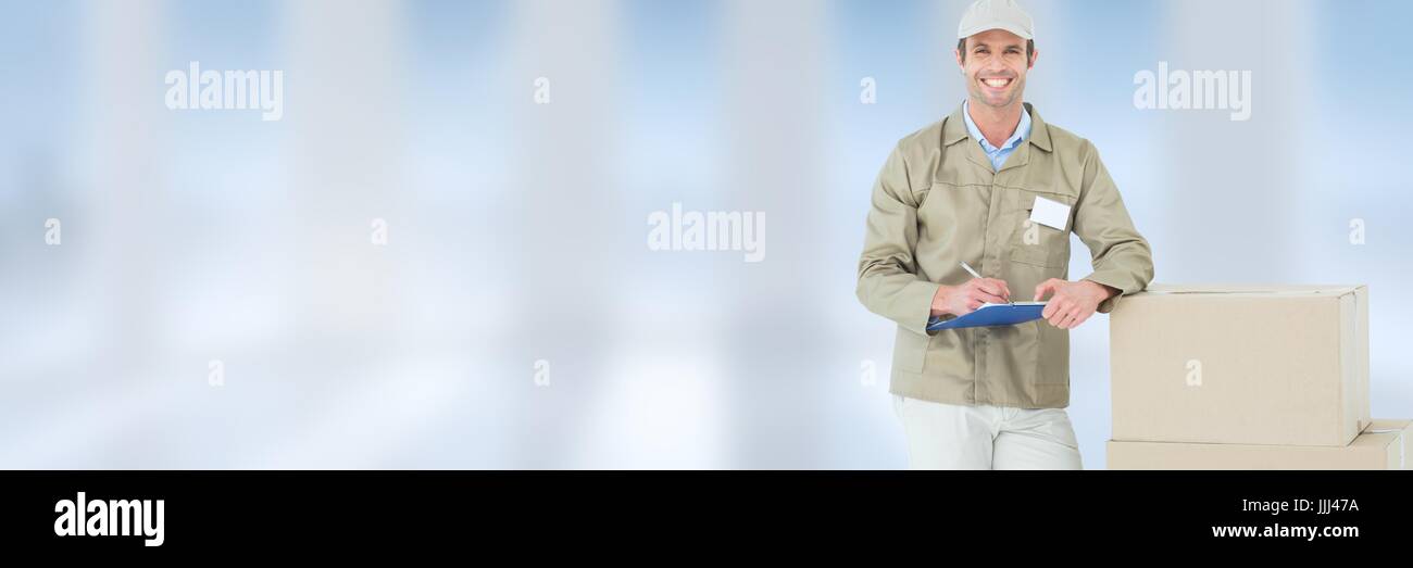 Delivery Courier with box in front of blurred background and copy space ...