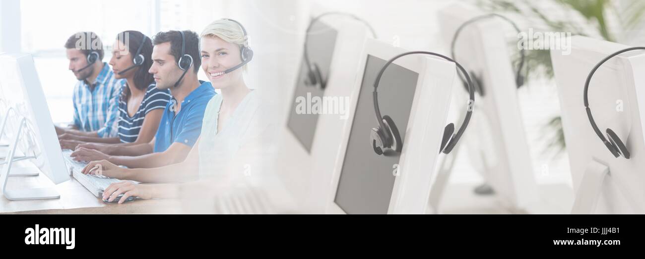 Customer service assistants with headsets with bright computer ...