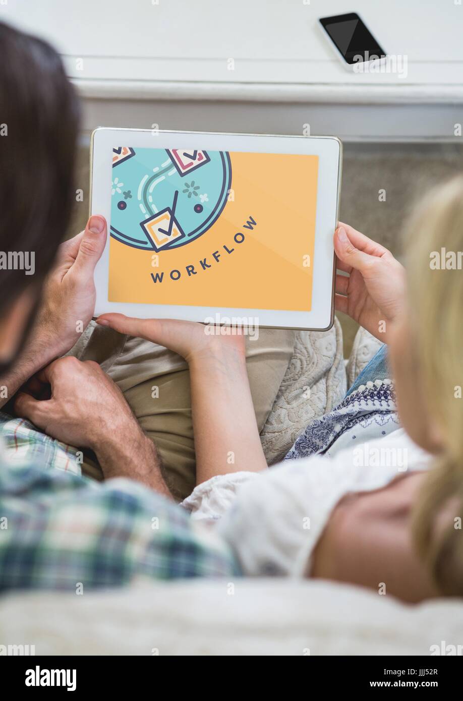 People looking at a tablet with education icon on the screen Stock ...