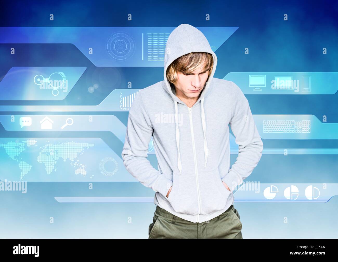 Hacker with a grey sweatshirt in front of blue digital background Stock ...