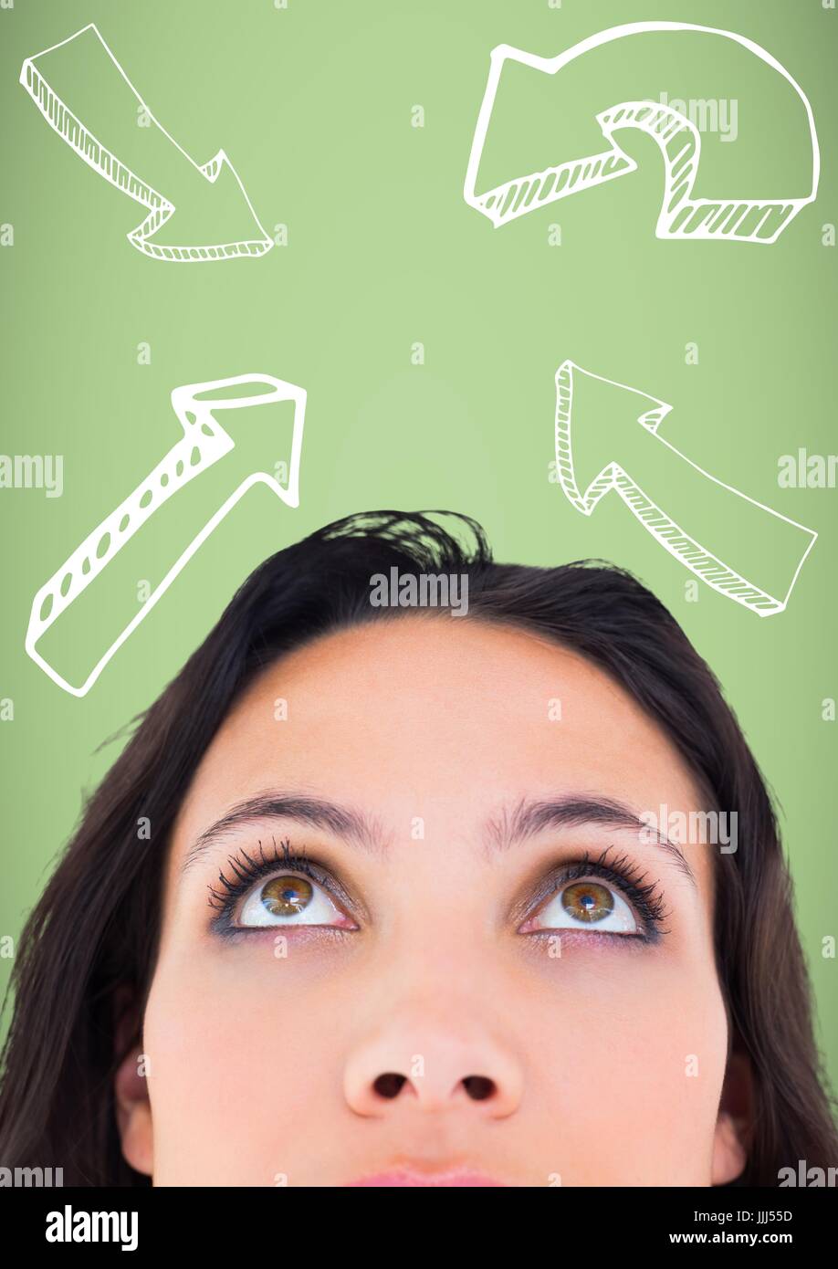 Top of woman's head looking up at white arrows against green background ...