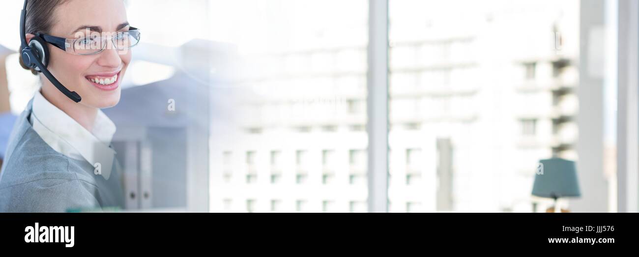 Customer service assistants with headsets with bright office background ...