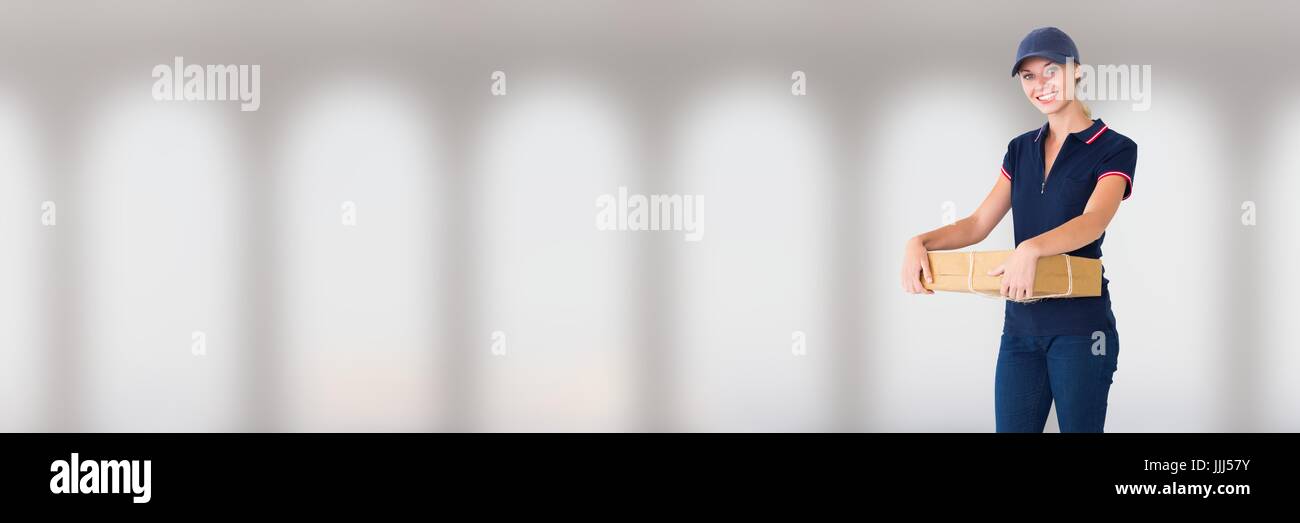 Delivery Courier with parcel in front of blurred and copy space ...