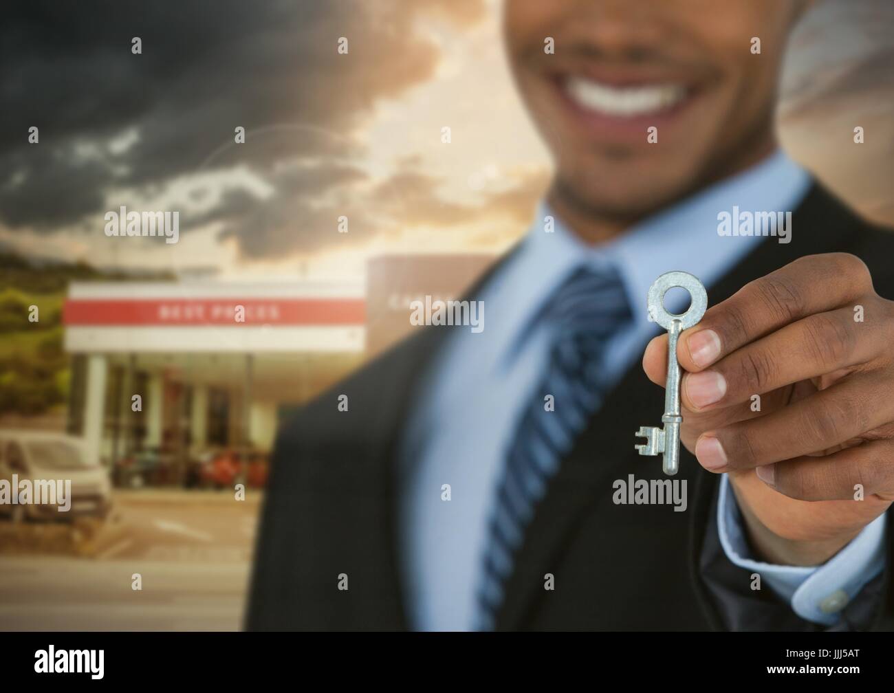 Man Holding Keys with cars Stock Photo - Alamy