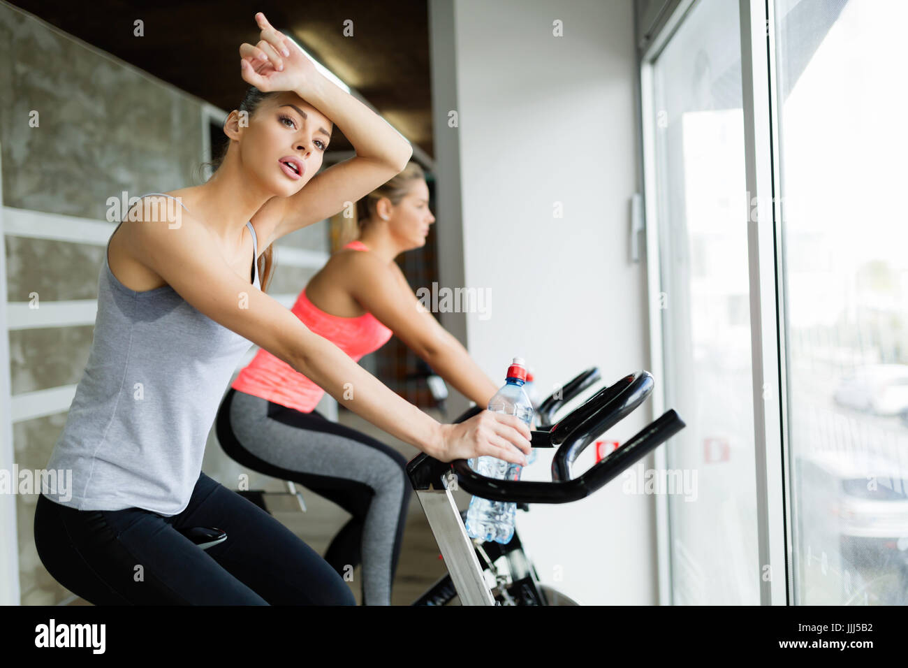 Women riding bike in hi-res stock photography and images - Alamy