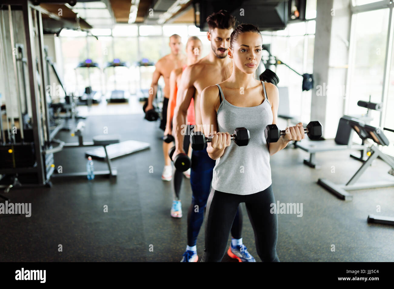 Group of people have workout in gym Stock Photo - Alamy