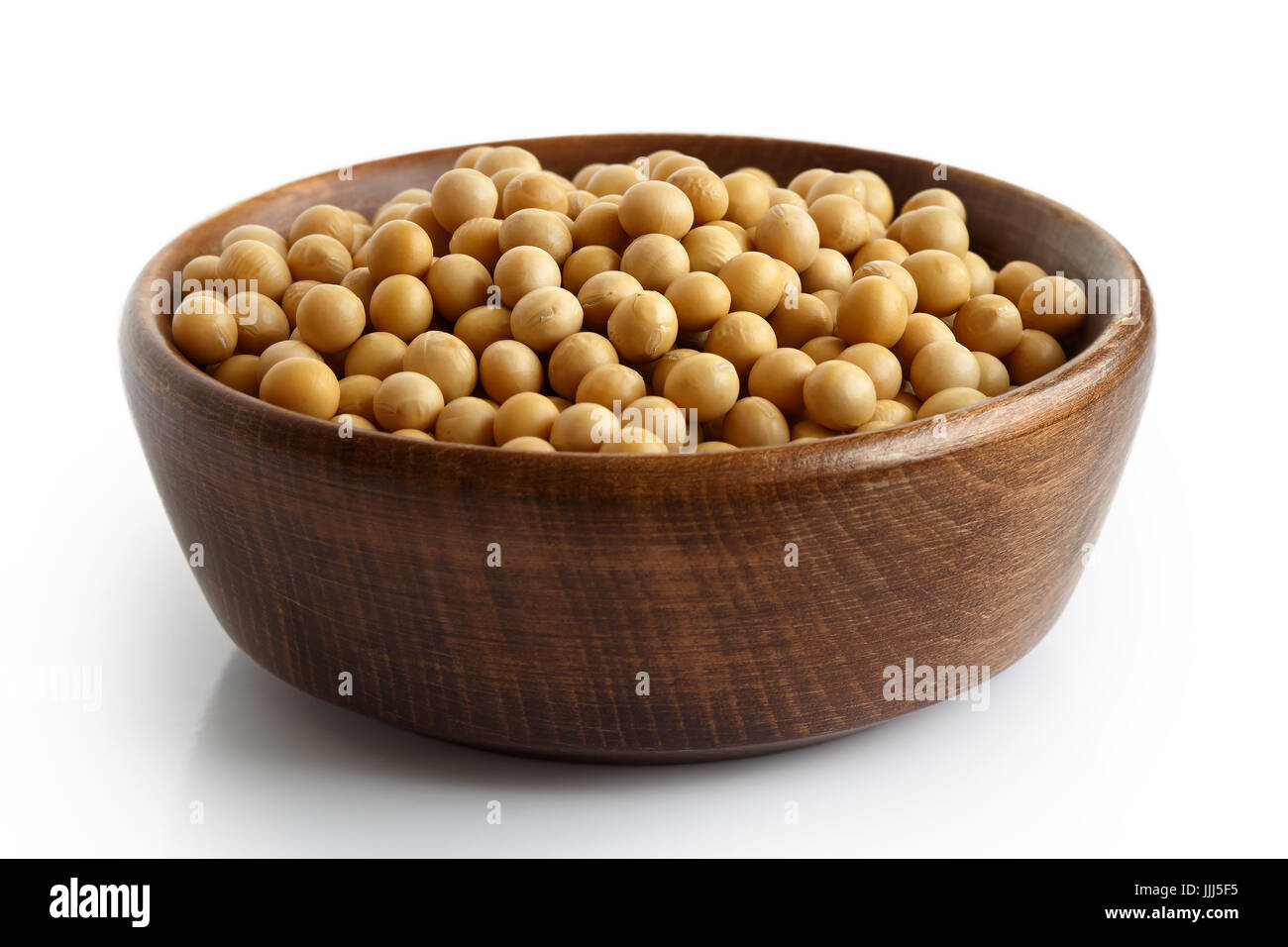 Dry soya beans in dark wooden bowl isolated on white Stock Photo - Alamy