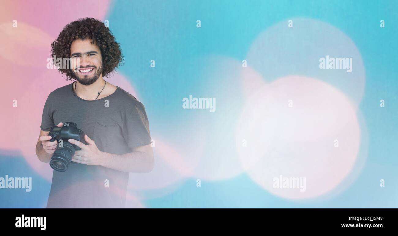 Smiling Photographer against glowing background Stock Photo - Alamy