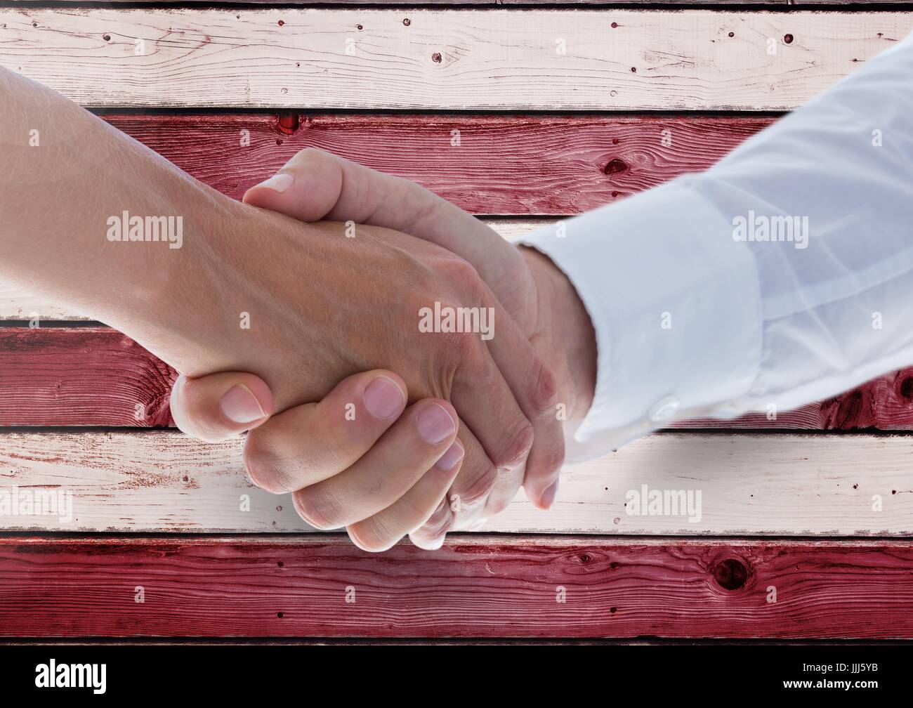 people shaking their hand together against american flag Stock Photo ...