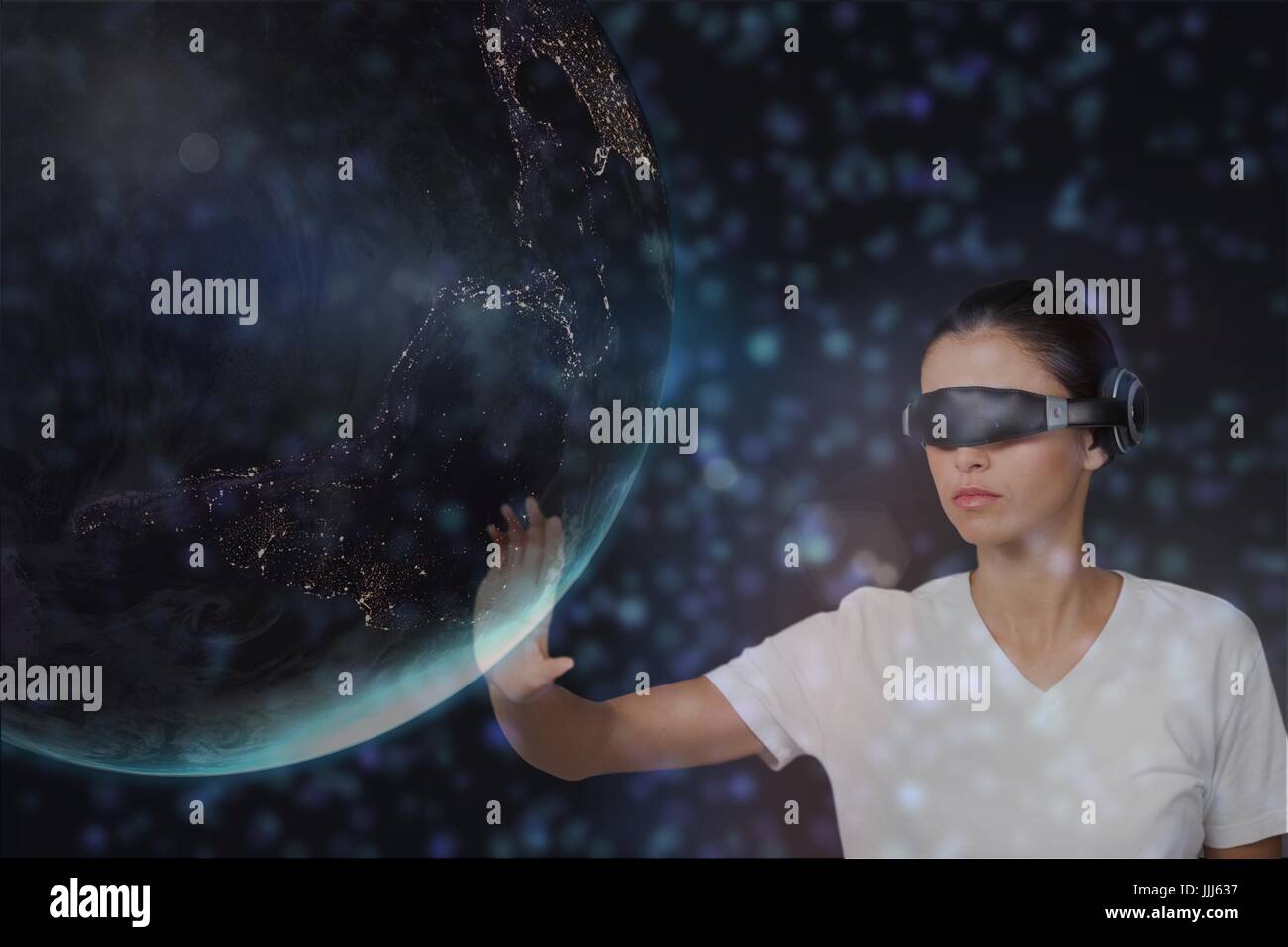 Woman in VR headset touching 3D planet against black background with ...