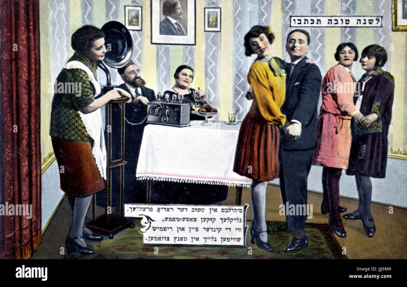 Young Jewish couples (man and a woman, 2 girls) dancing at home to an ...