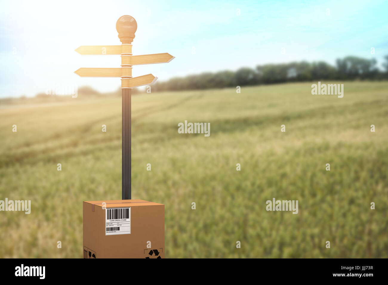 Composite image of cardboard box by road sign Stock Photo - Alamy