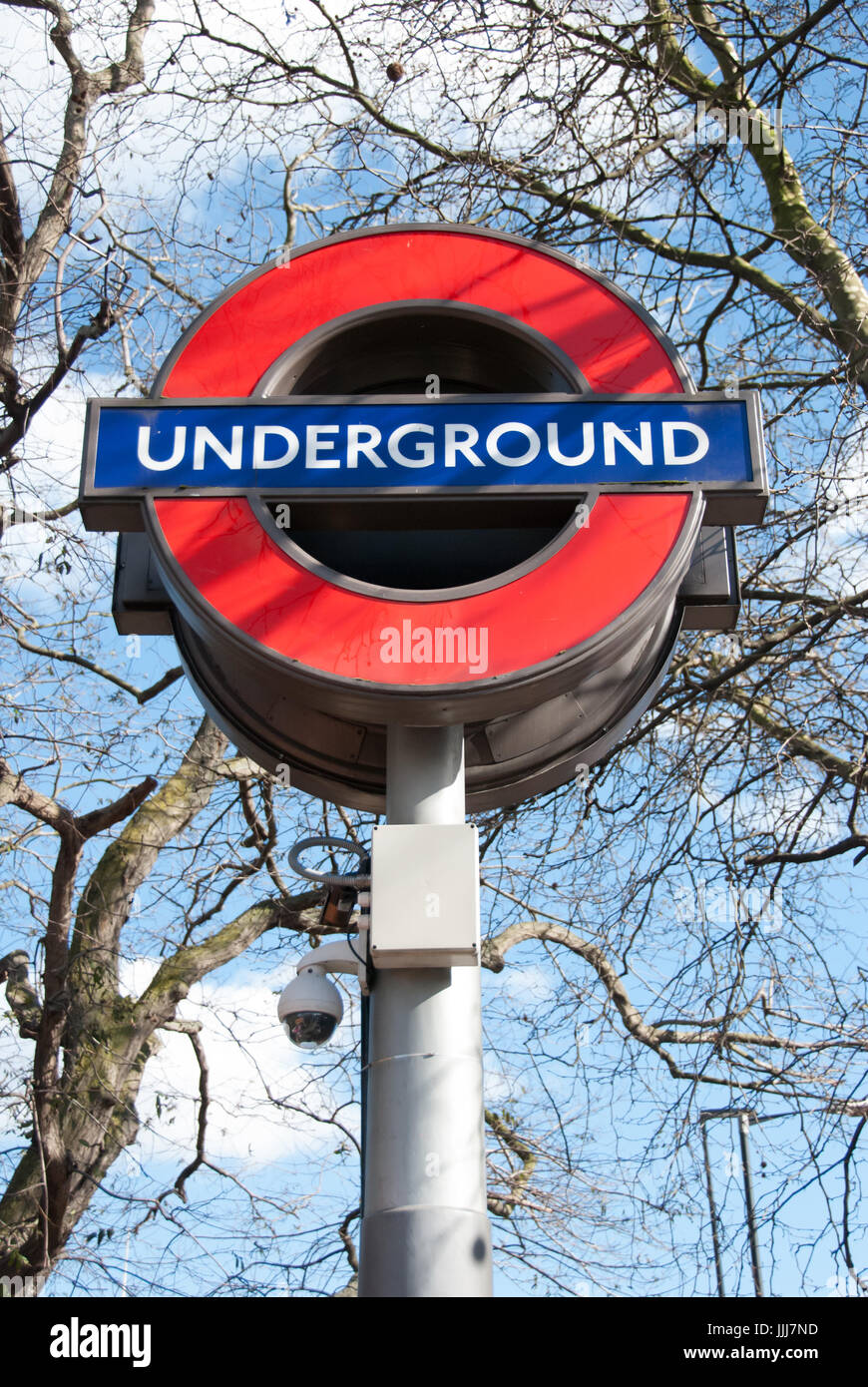 Hyde park, London. Underground station sign with a security camera on ...