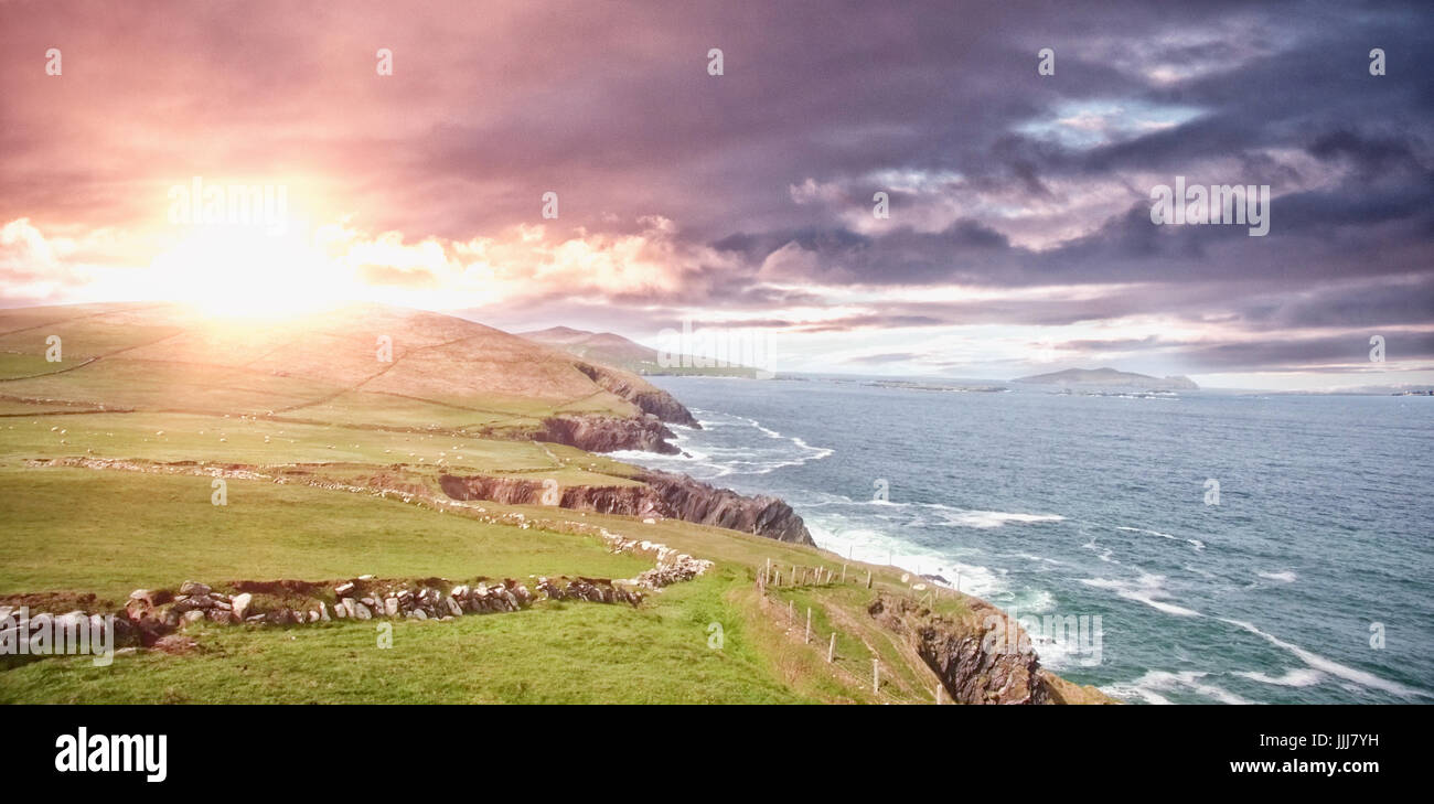 Idyllic view of landscape by ocean Stock Photo - Alamy
