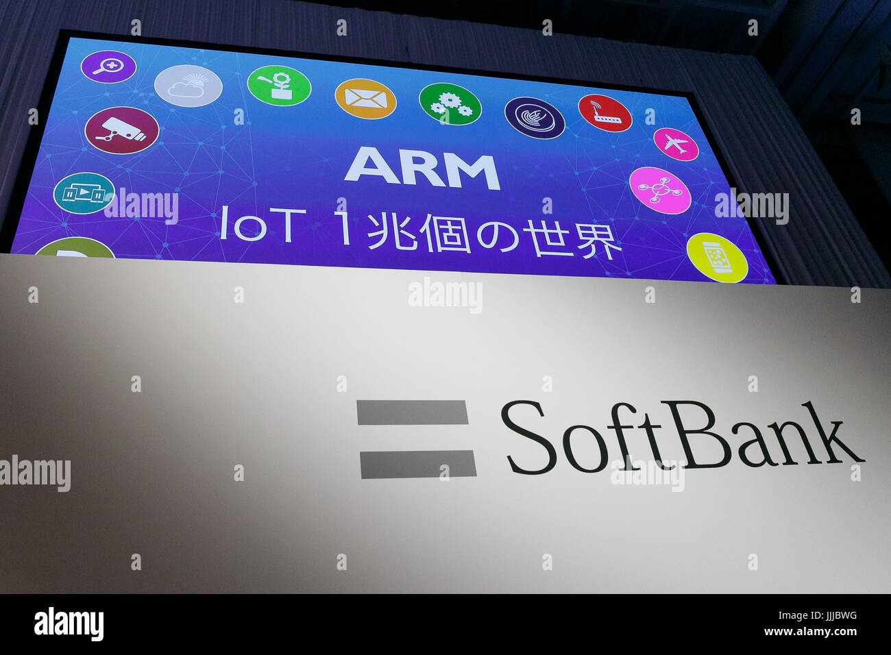 Logos of SoftBank (down) and ARM (up) companies on display during the ...
