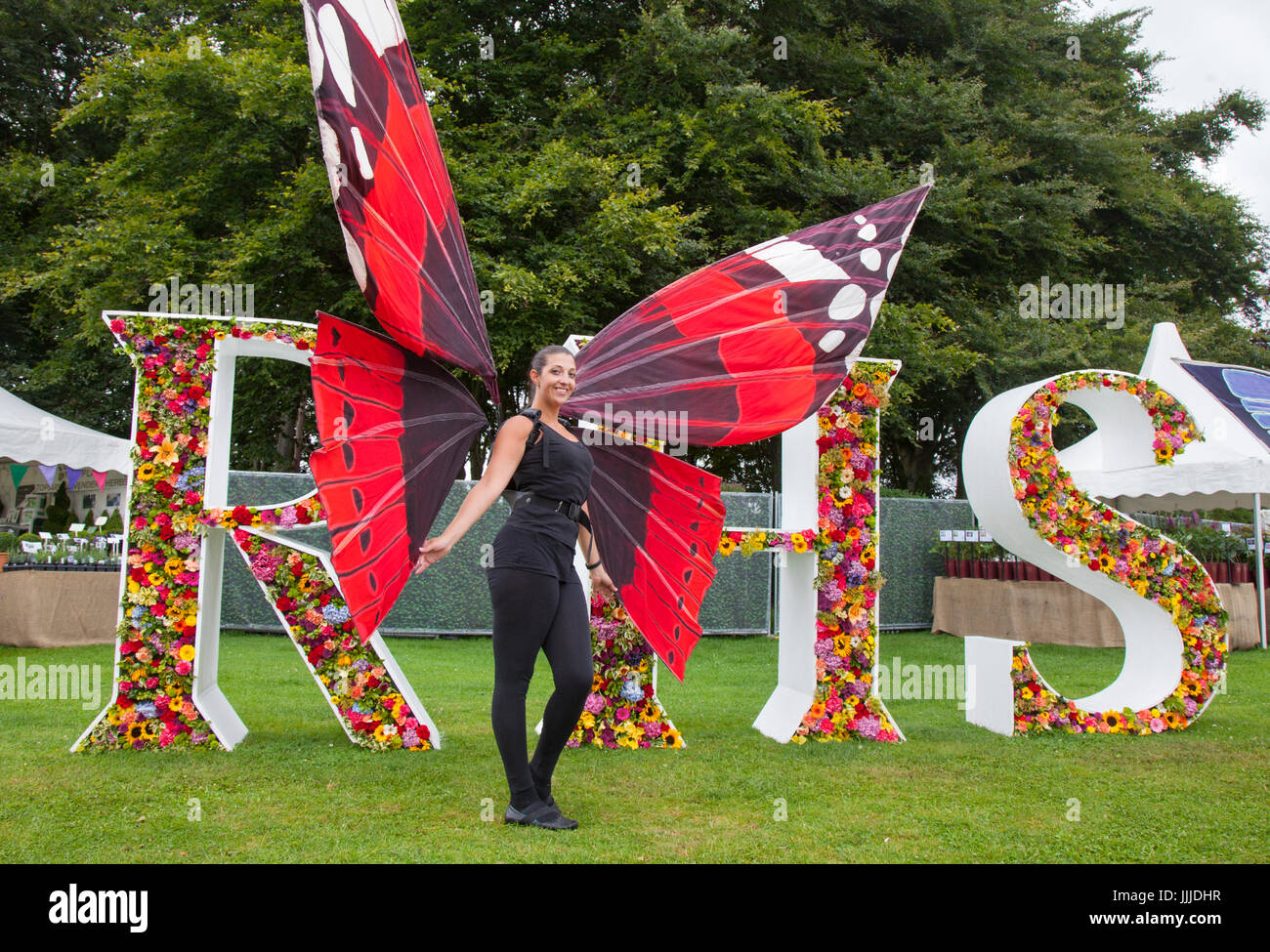 Woman wearing butterfly wings, blue, orange, pink, big kid costume ...