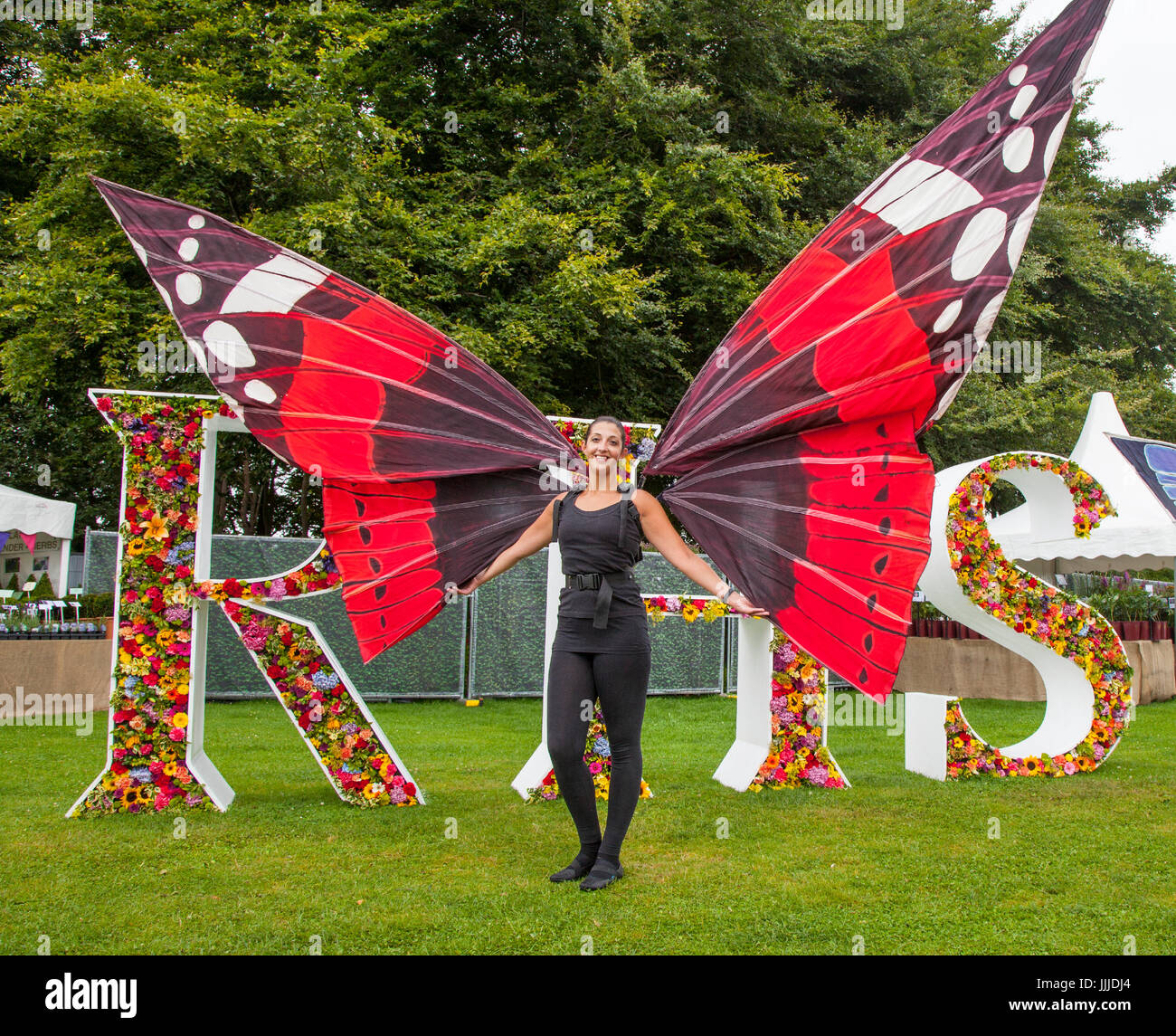Woman wearing butterfly wings, blue, orange, pink, big kid costume ...