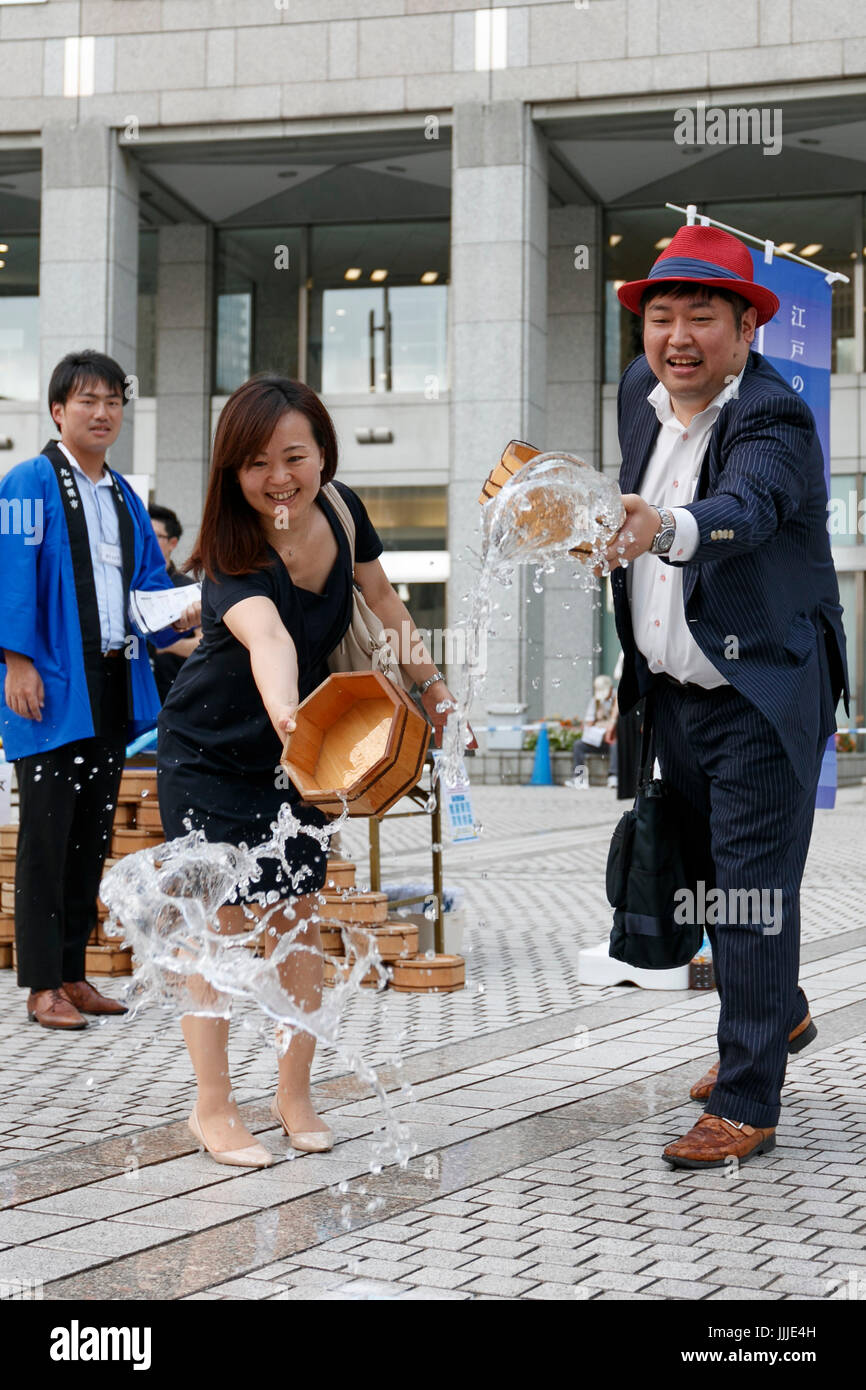 Tokyo, Japan. 20th July, 2017. Visitors enjoy sprinkling water during ...