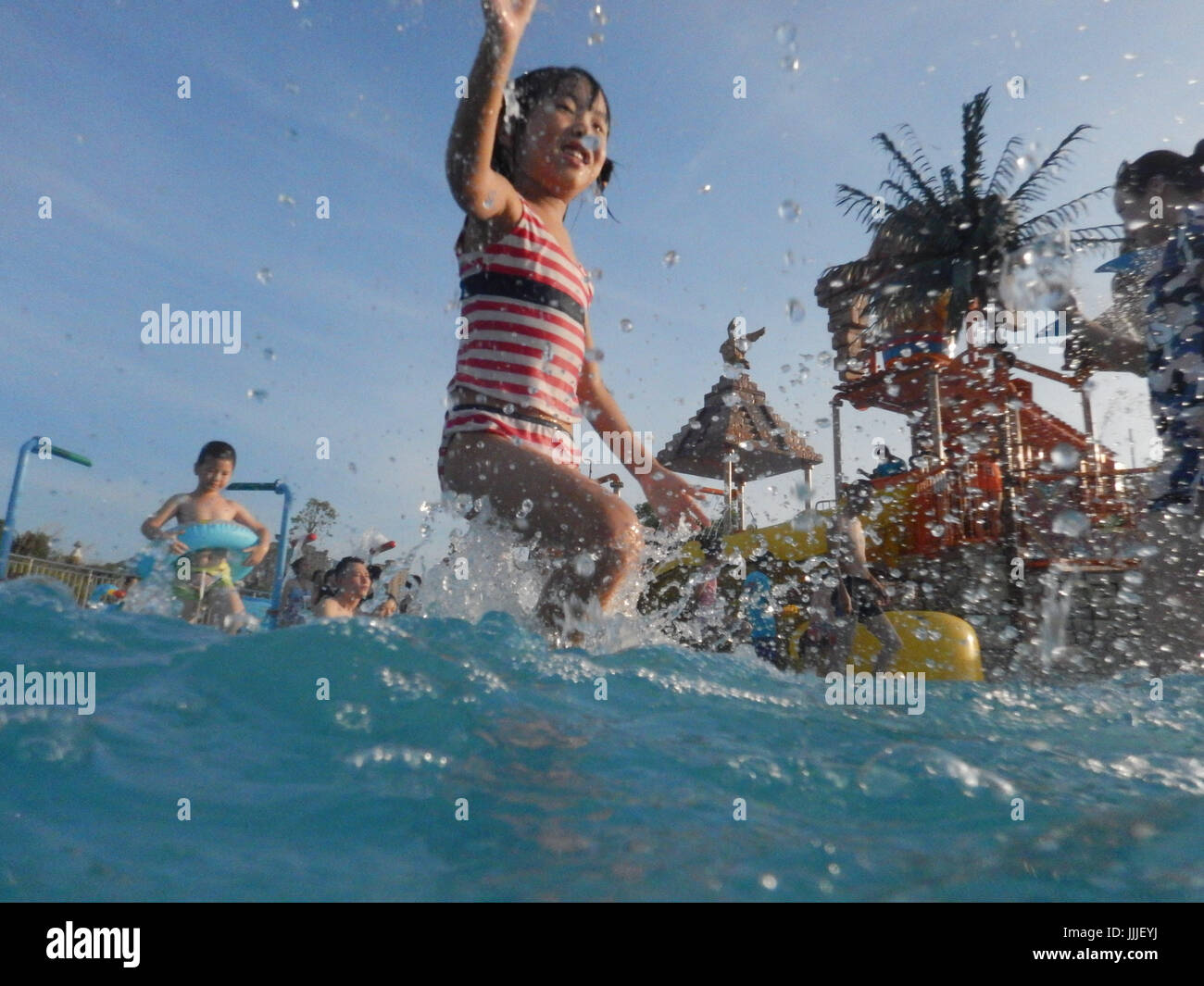 Beijing, China's Fujian Province. 19th July, 2017. Kids play water at a ...