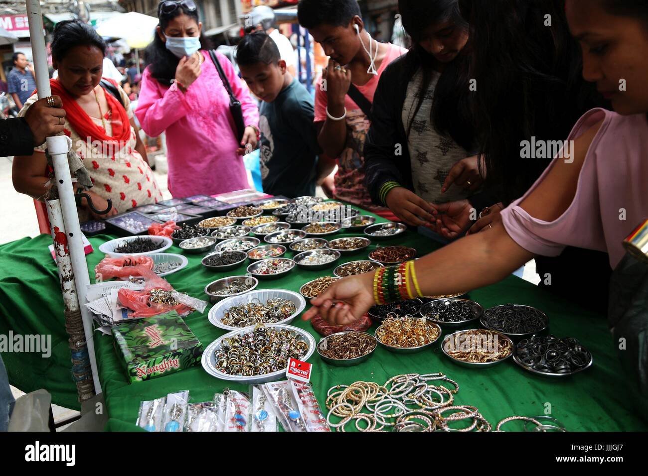 Kathmandu, Nepal. 20th July, 2017. Nepalese people select rings at a ...