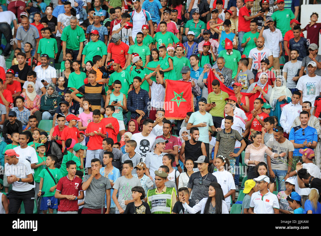 Fans hold Morocco flags during the Meeting International Mohammed VI d ...