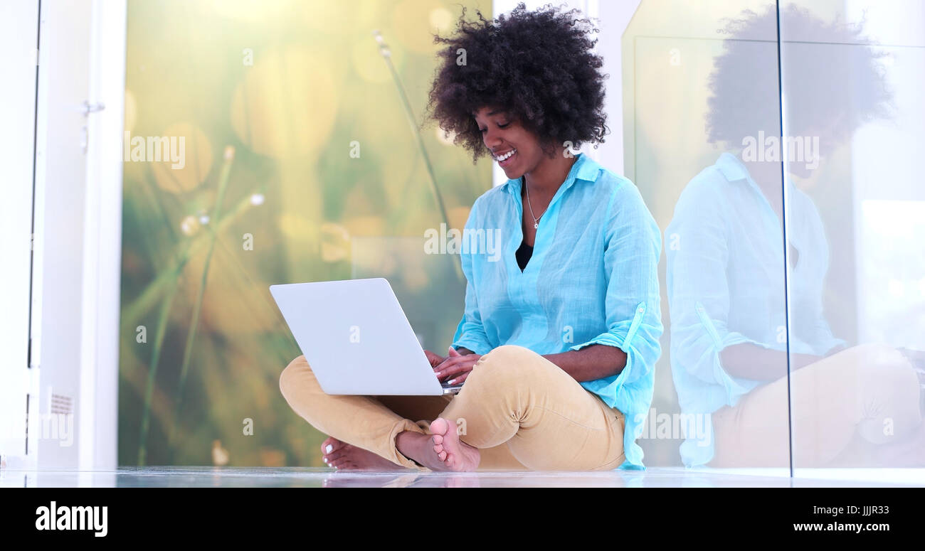 beautiful young african american women using laptop computer on the ...
