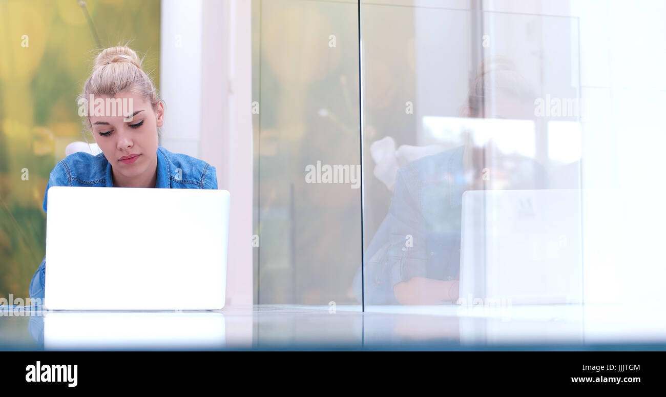 beautiful young women using laptop computer on the floor of her luxury ...