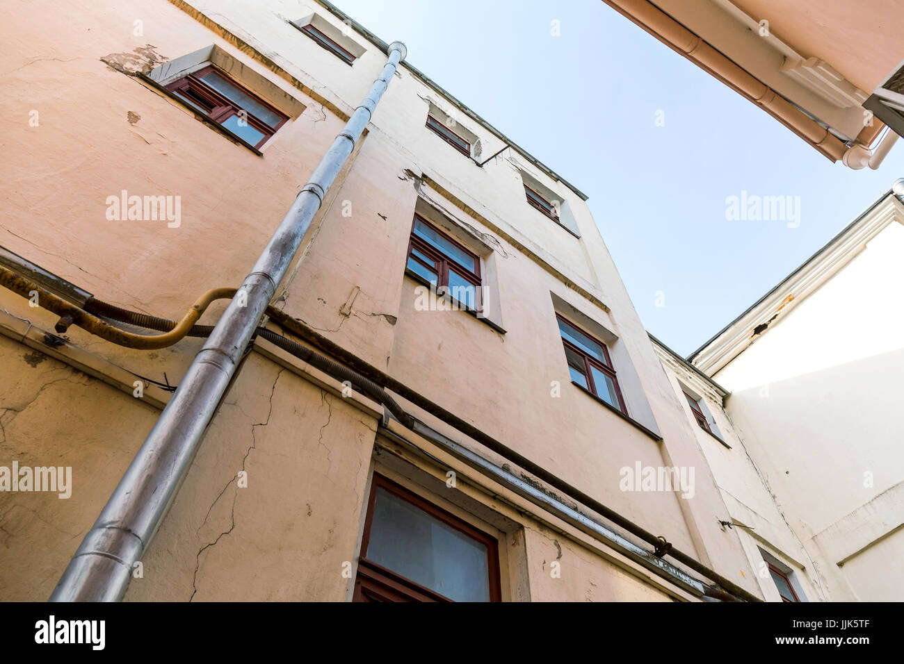 old apartment buildings on blue sky background. view from bottom Stock ...