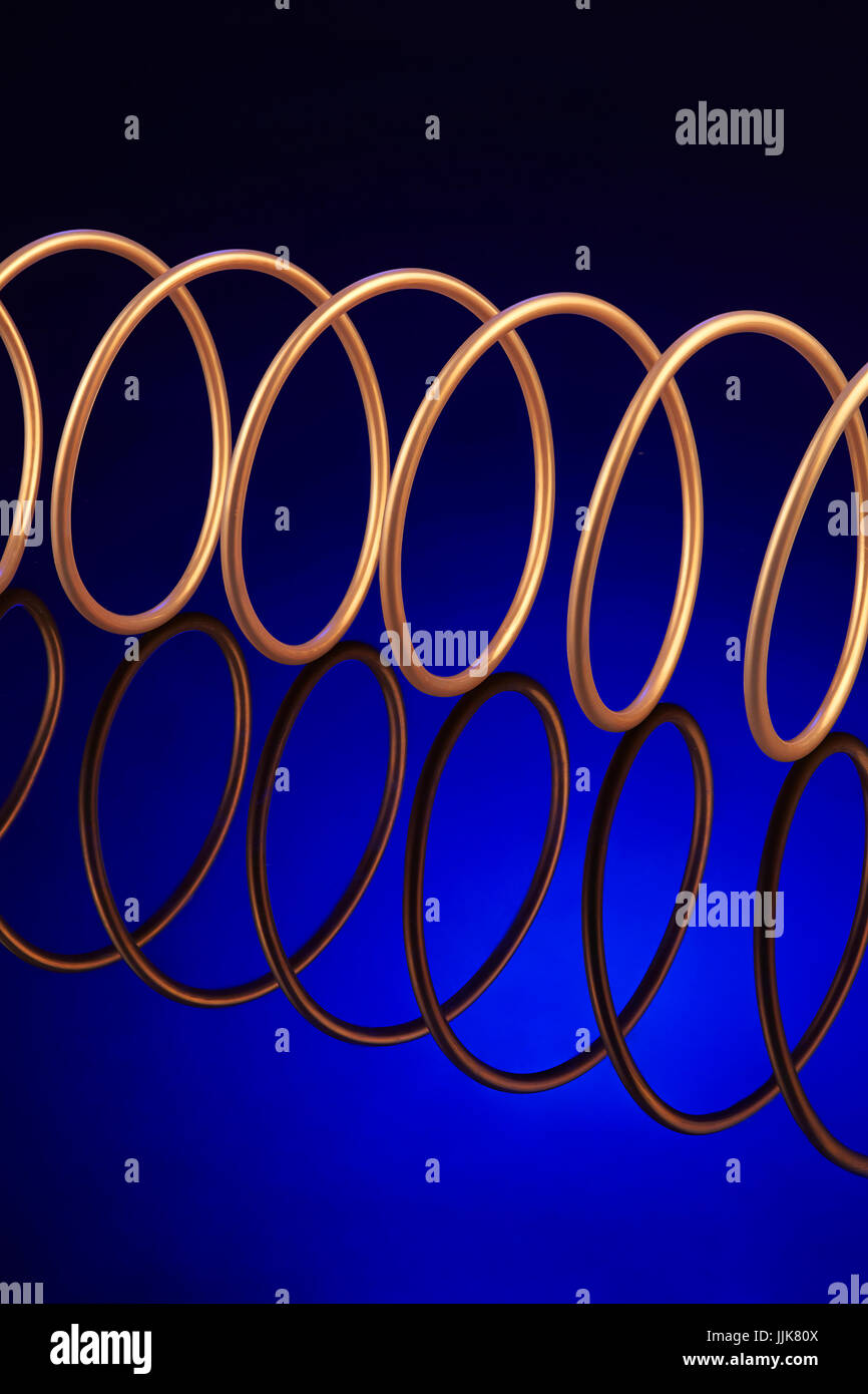 Spiral of copper wire on metal surface abstract industry Stock Photo ...