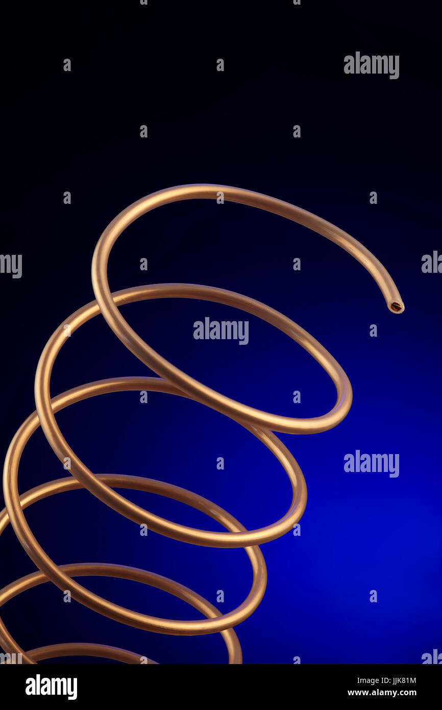 Spiral of copper wire on metal surface abstract industry Stock Photo ...