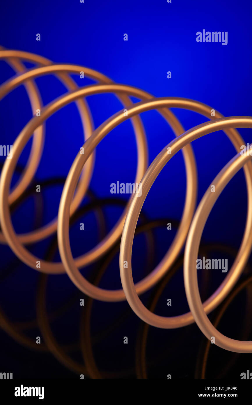 Spiral of copper wire on metal surface abstract industry Stock Photo ...