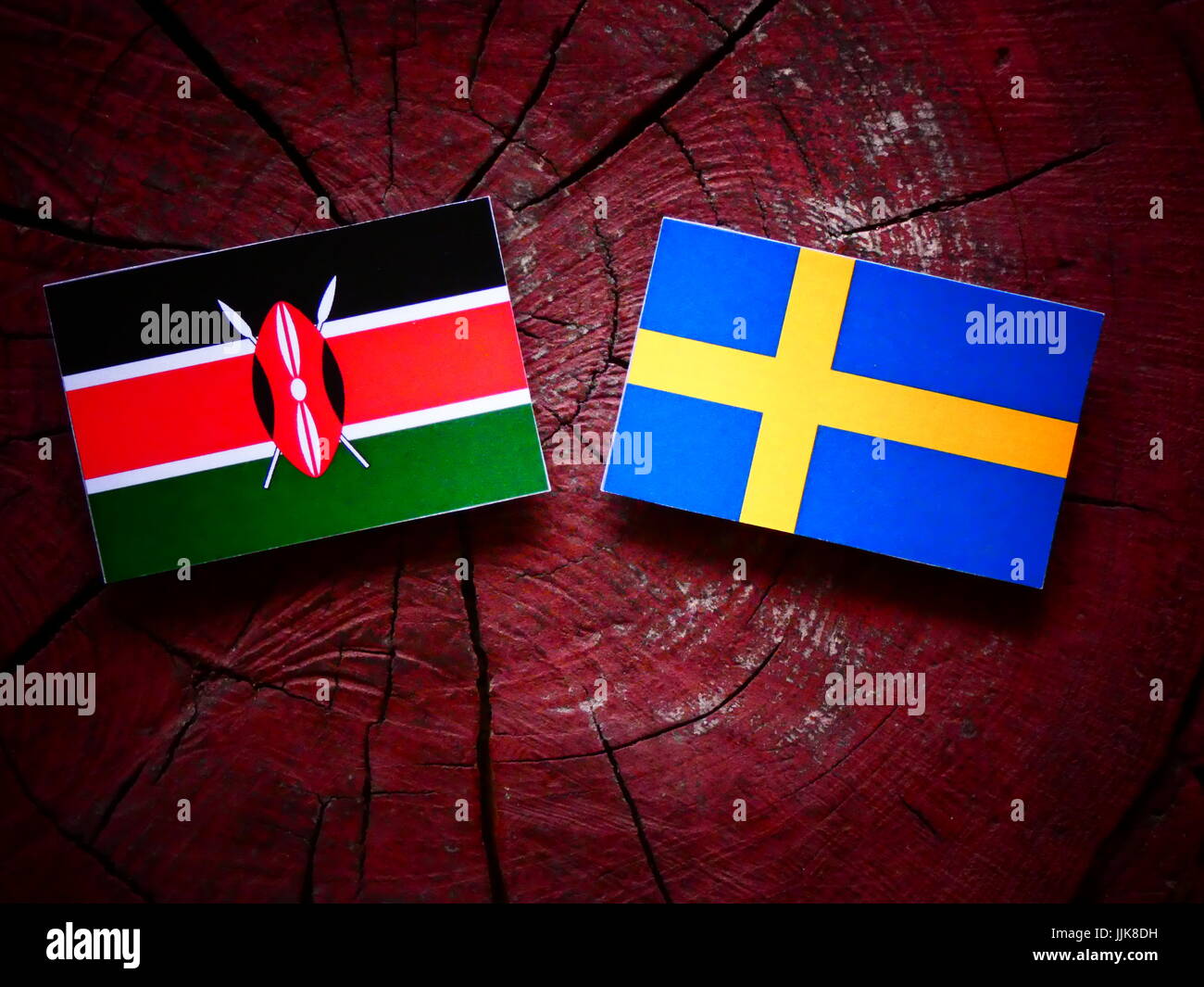 Kenyan flag with Swedish flag on a tree stump isolated Stock Photo - Alamy