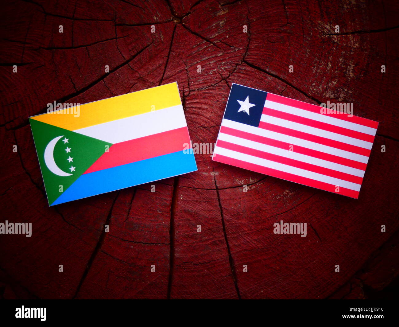 Comoros flag with Liberian flag on a tree stump isolated Stock Photo ...