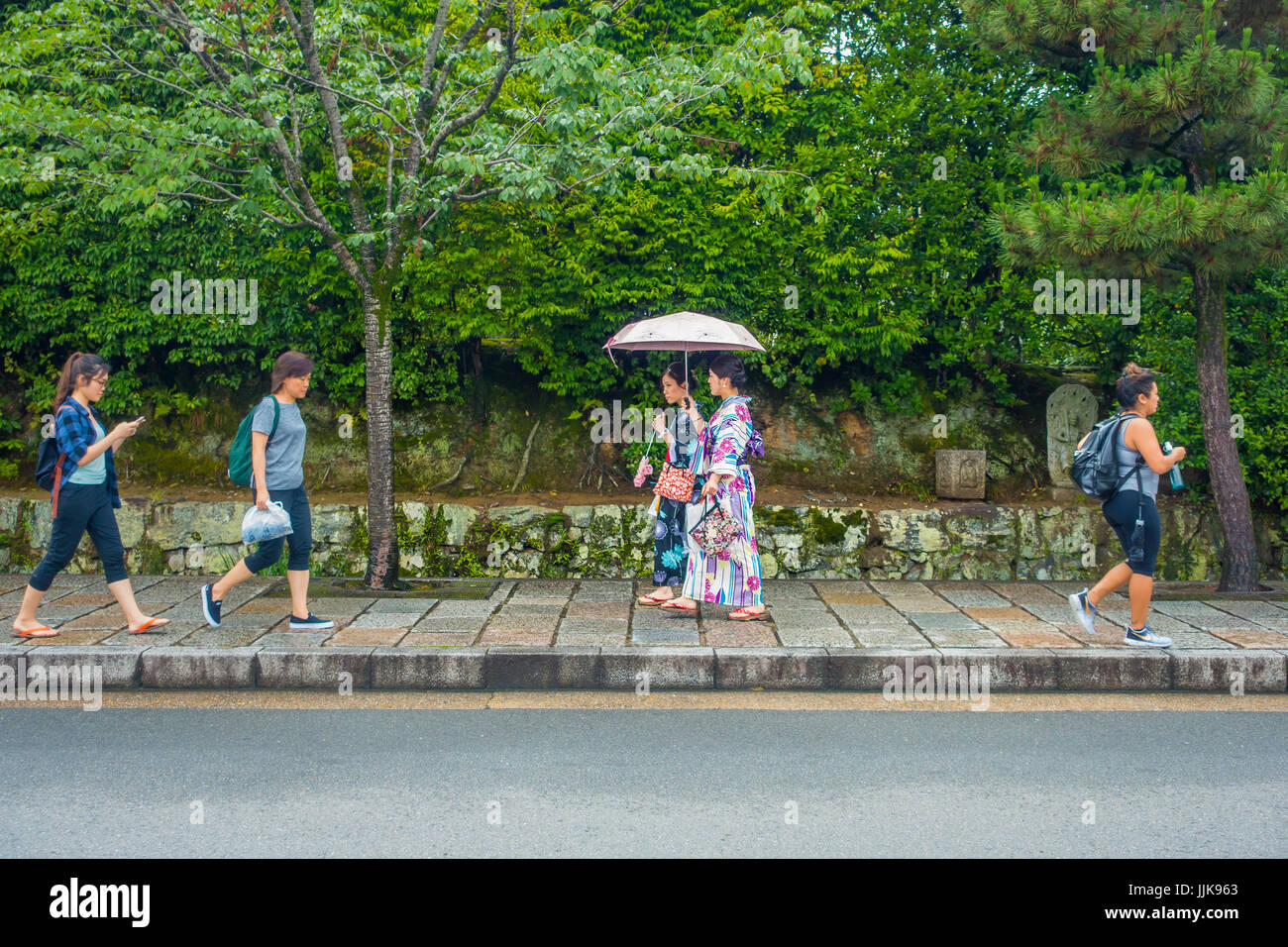 KYOTO, JAPAN - JULY 05, 2017: Unidentified people walking in a path at ...